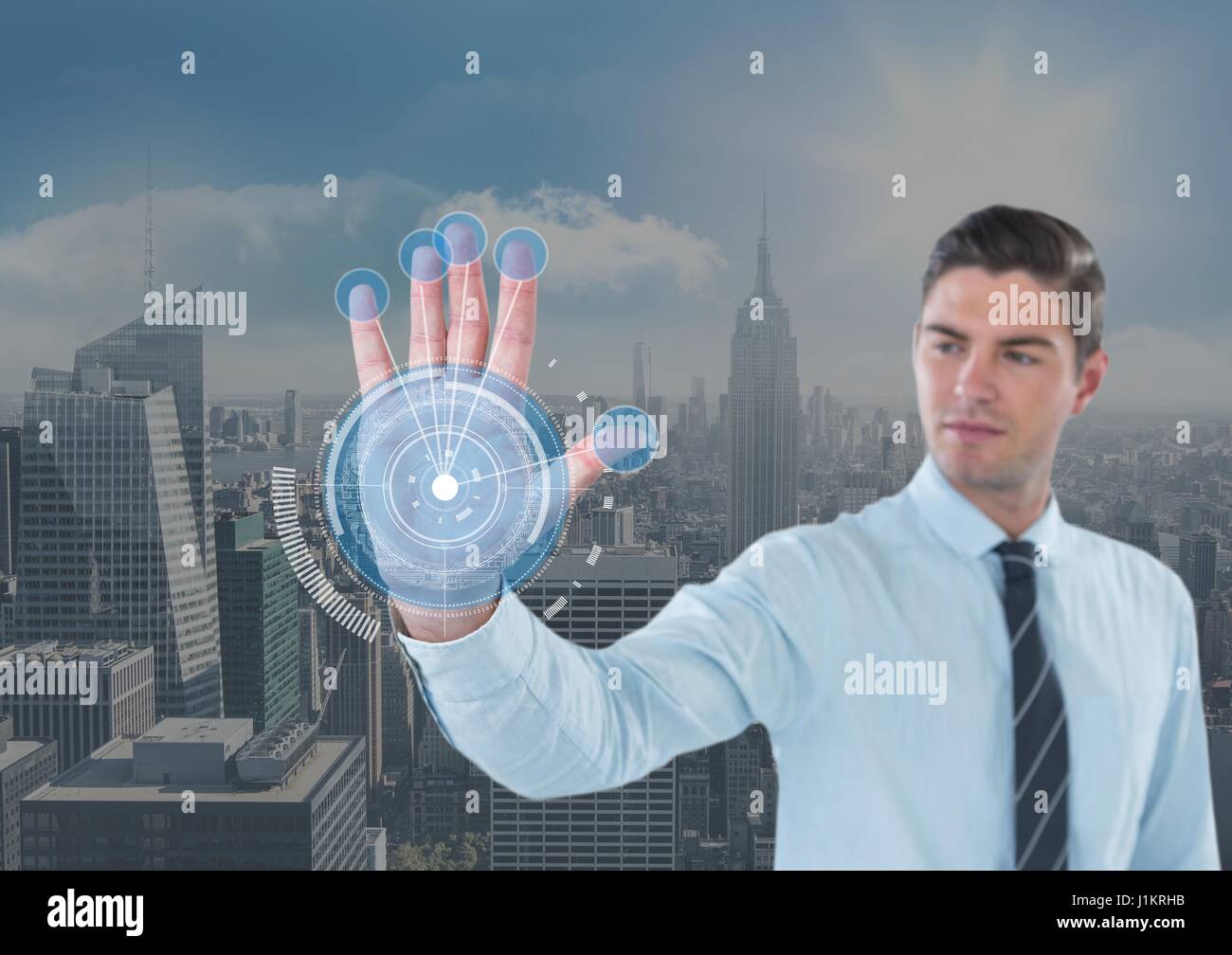Digital composite of Business man with hand scan in front of the city ...