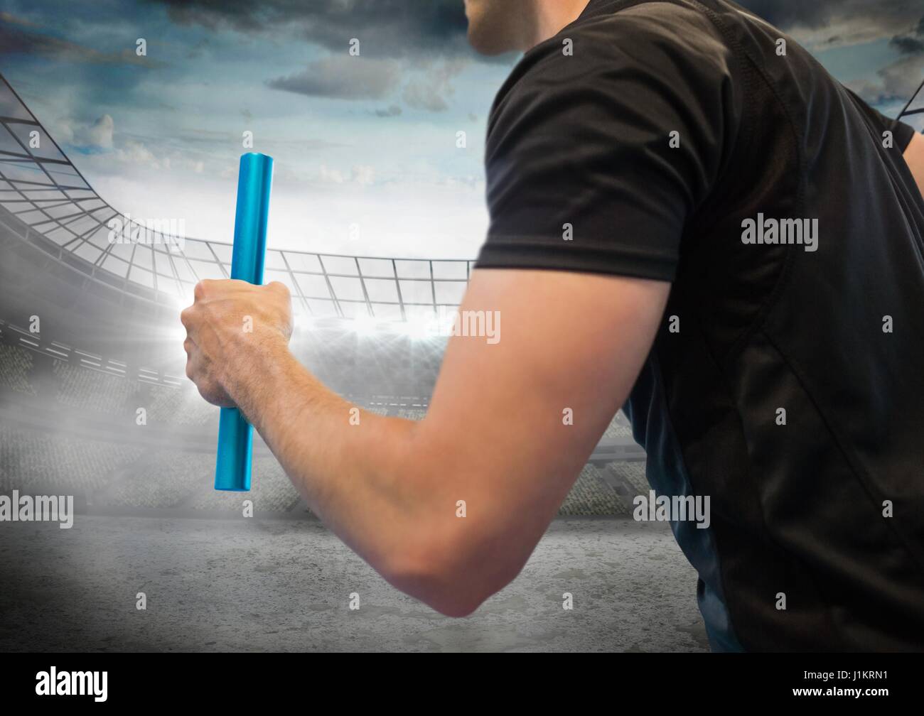 Digital composite of Hand with blue baton against stadium with flares ...