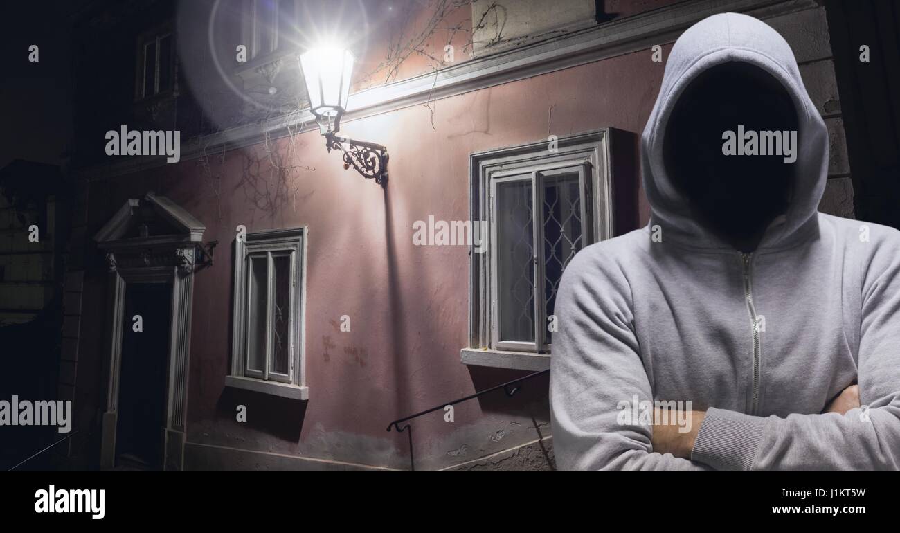 Digital composite of Anonymous Criminal in hood on dark street Stock ...