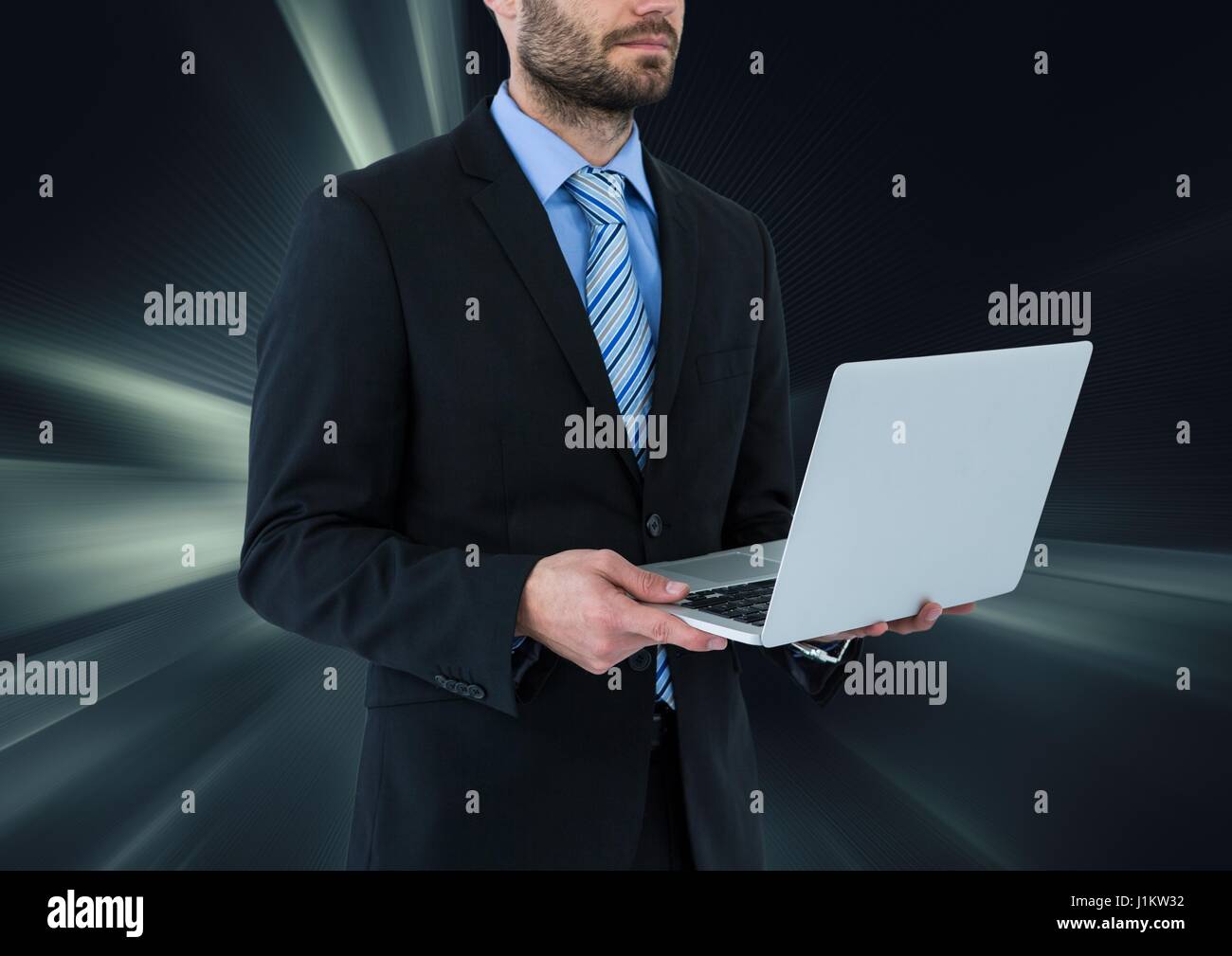 Digital composite of man on laptop with dark virtual background Stock ...