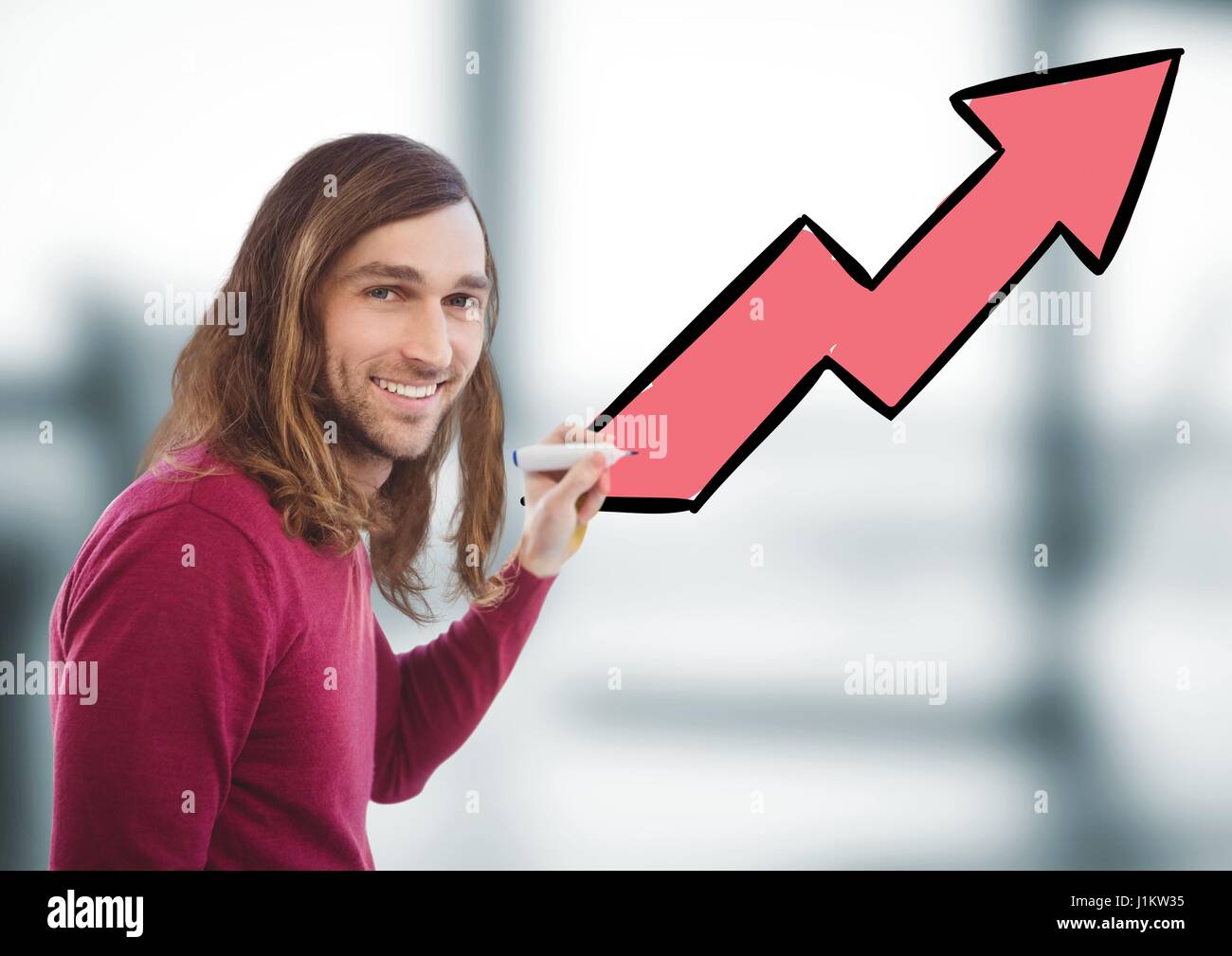 Digital composite of Man with pen against arrow and blurry grey office ...