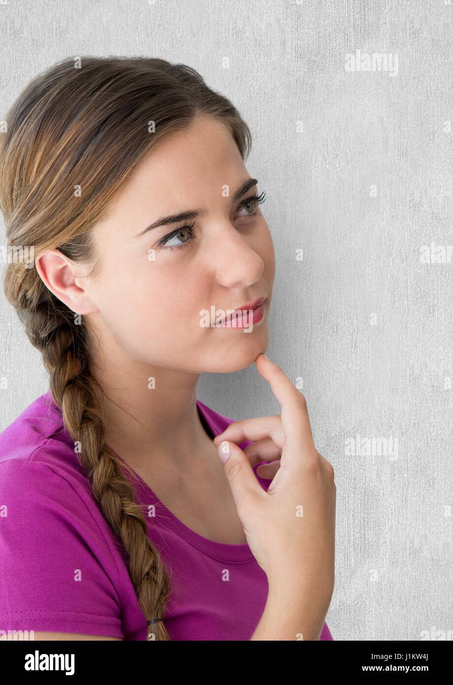 Digital composite of Thoughtful woman touching chin Stock Photo - Alamy