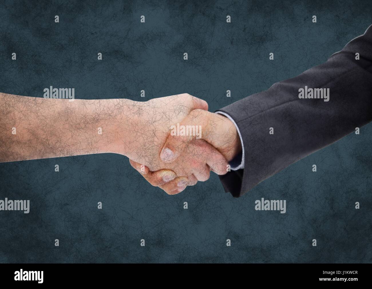 Digital composite of Handshake against dark blue grunge background ...