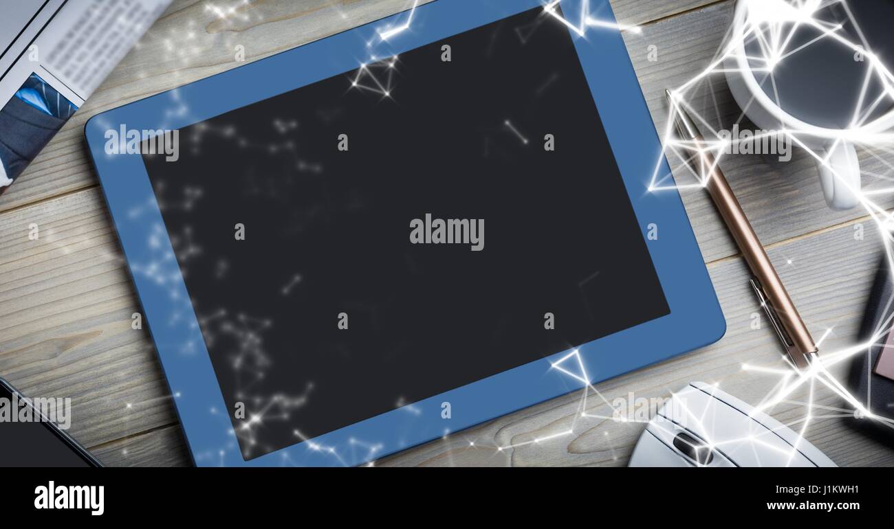Digital composite of Tablet on table with white network overlay Stock ...