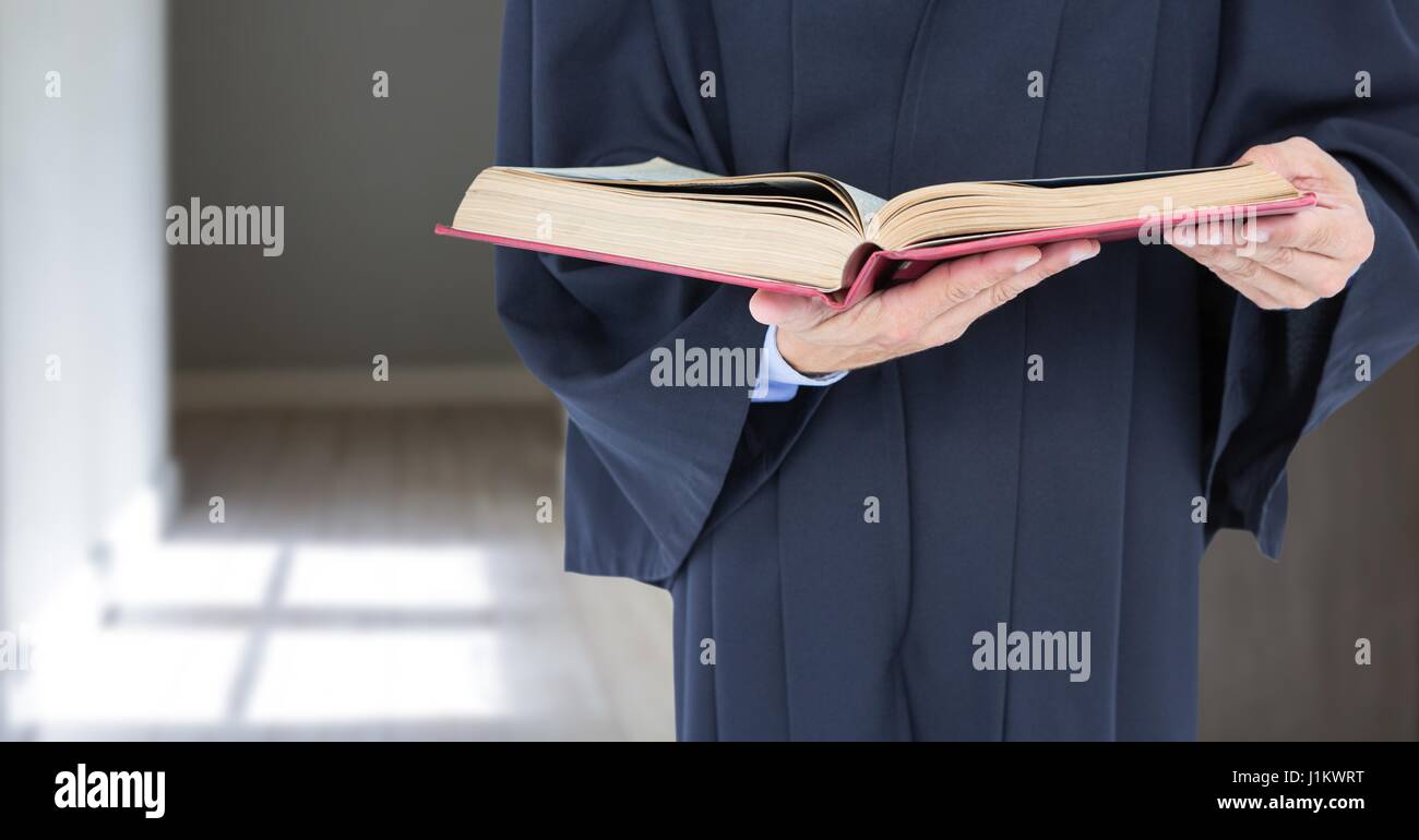 Digital composite of Judge holding book in front of corridor Stock ...