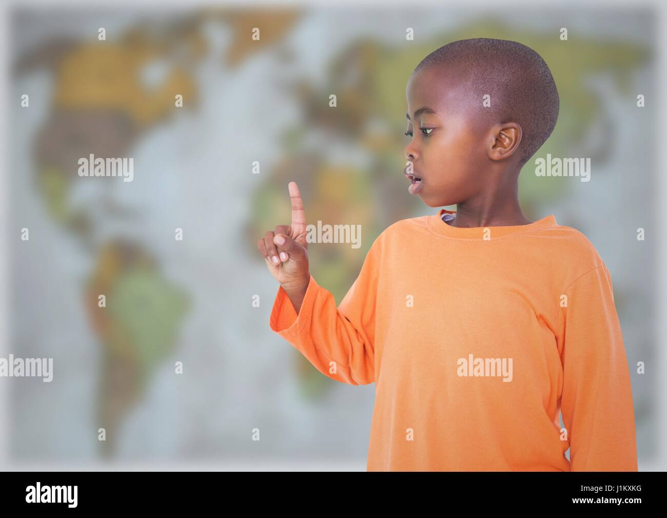 Digital composite of Boy pointing against blurry map Stock Photo - Alamy
