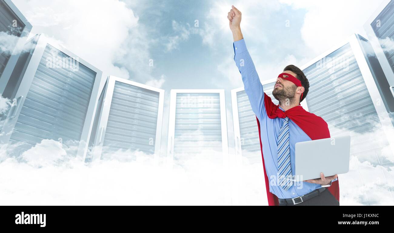Digital composite of Business man superhero with laptop and hand in air ...