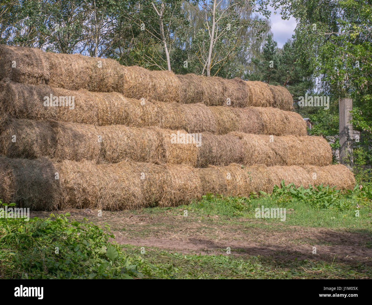 Big bales of straw organized in a pyramid Stock Photo - Alamy