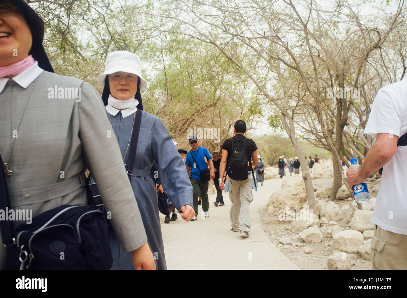 Nuns walking on the small street linking the waterfalls with the Dead ...