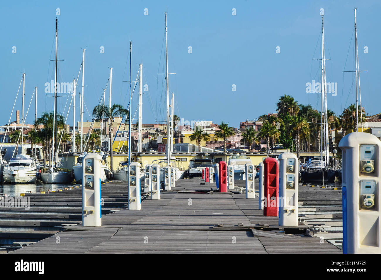 Inside the harbor (load the boats with electric power Stock Photo - Alamy