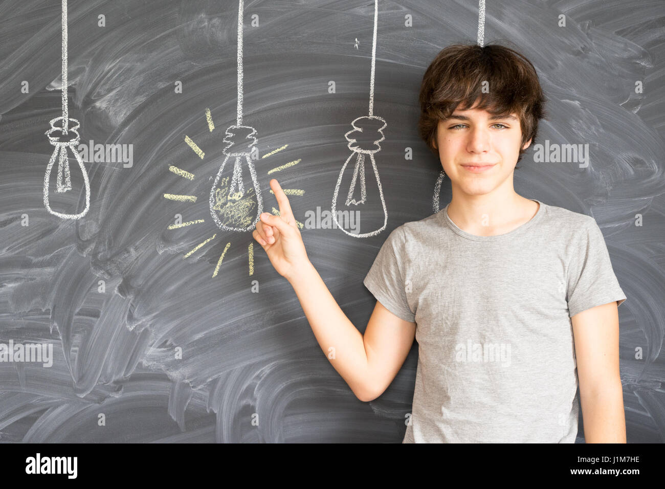 Teenager boy getting an idea Stock Photo - Alamy
