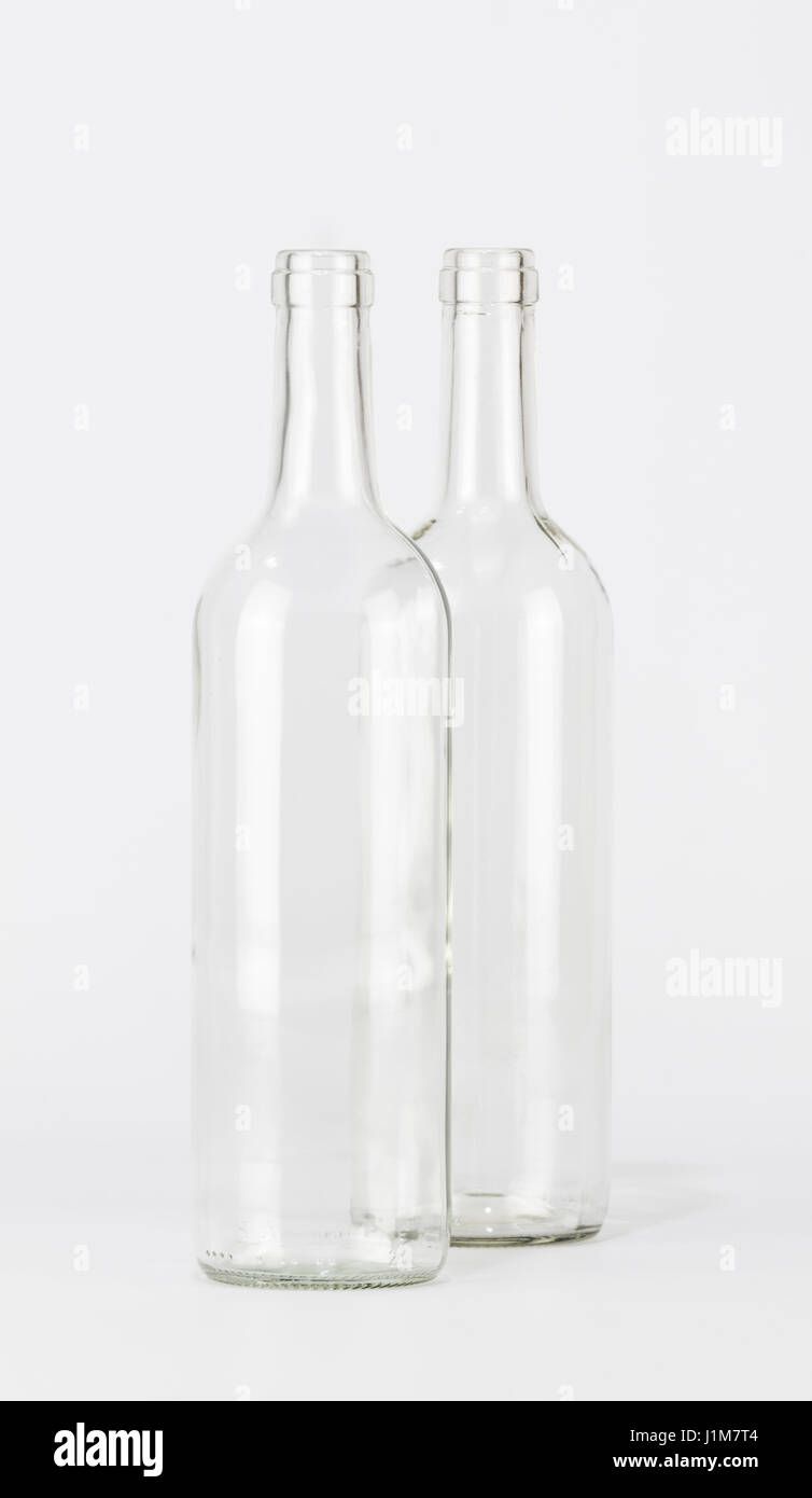 Two empty glass bottle isolated on white background Stock Photo - Alamy