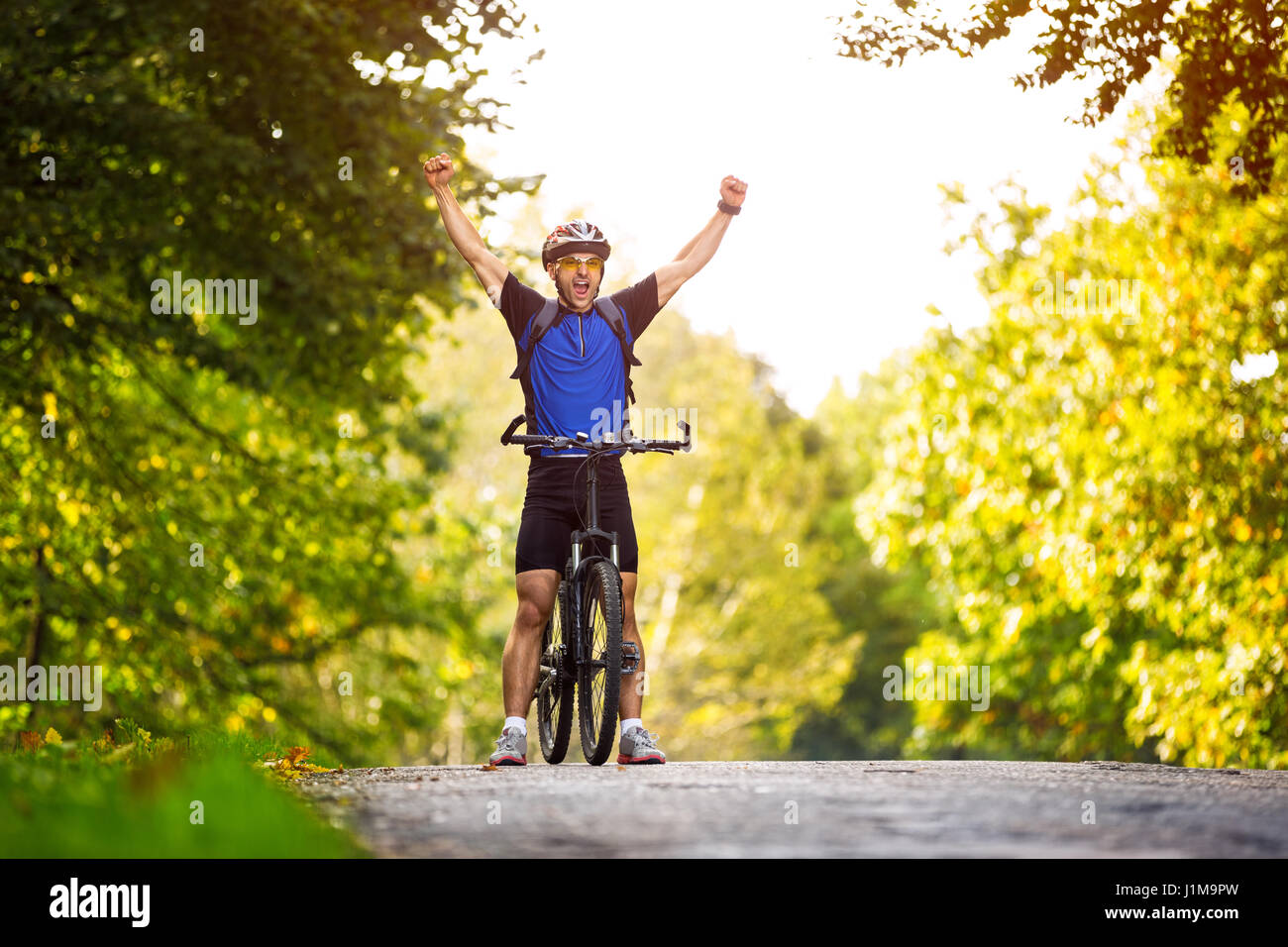 happy cyclists, he is winner Stock Photo - Alamy