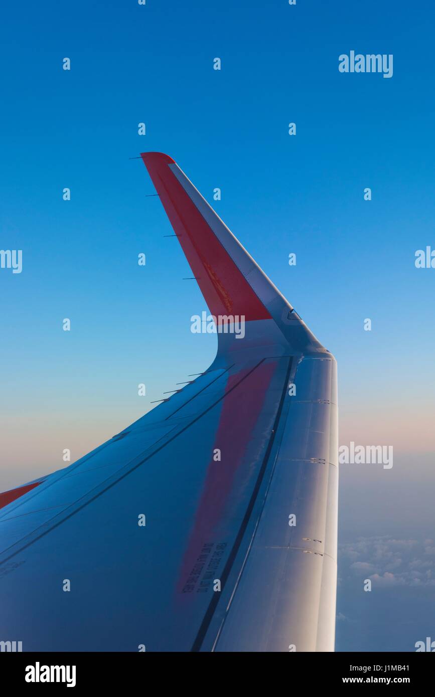 Winglet on a passenger airliner cruising at high altitude. Winglets improve the efficiency of ...