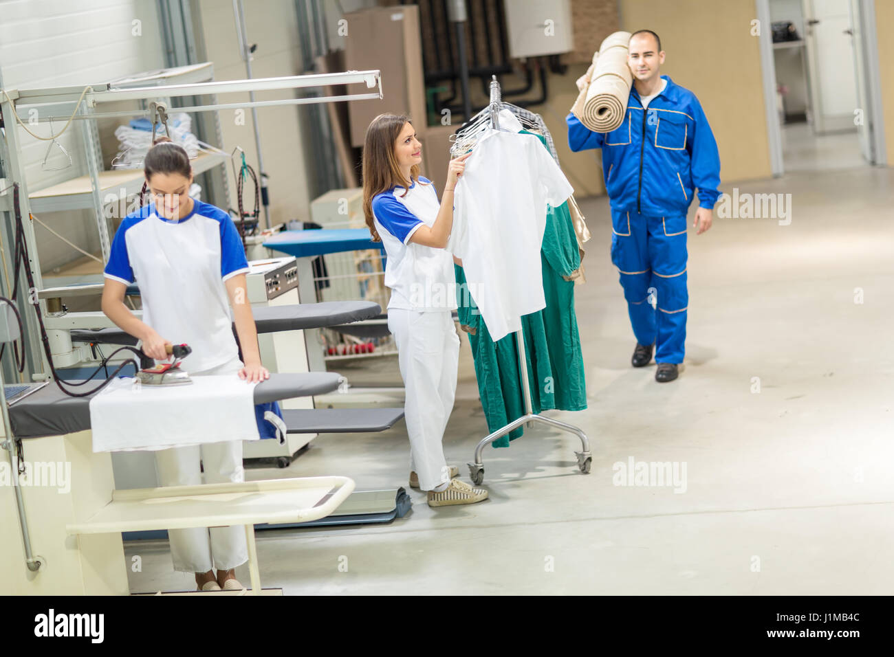 Laundry employee hi-res stock photography and images - Alamy