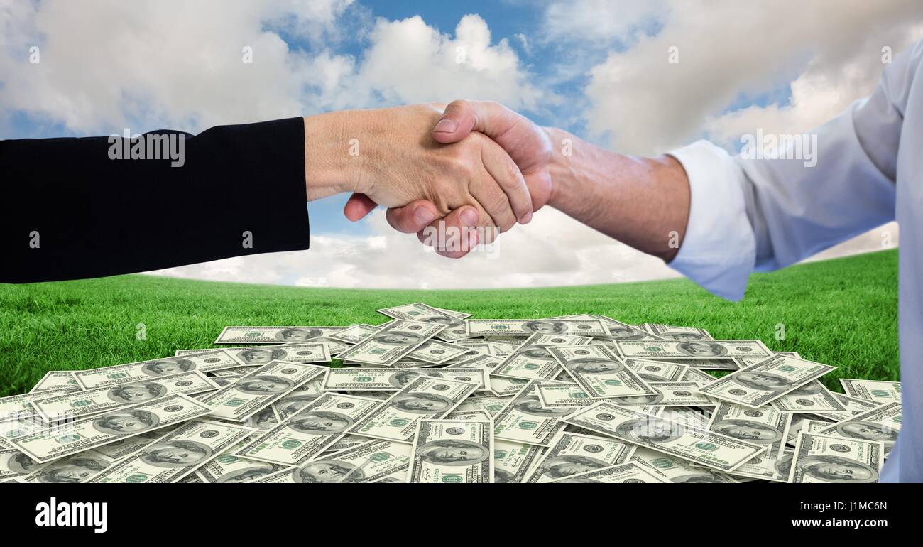 Digital composite of Close-up of handshake with money in background ...