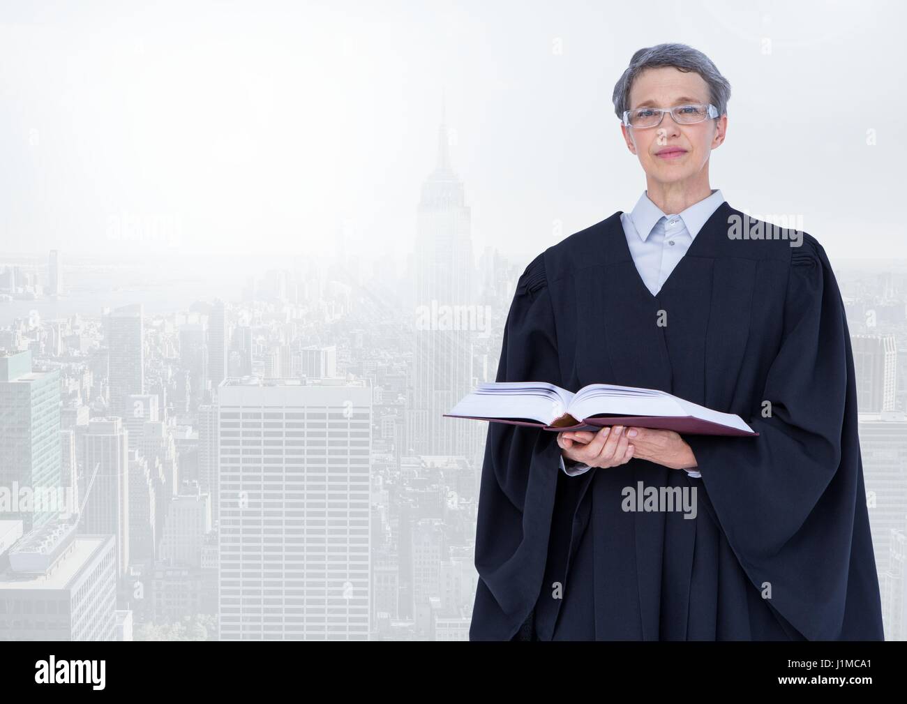 Digital composite of Judge holding book in front of bright city Stock ...