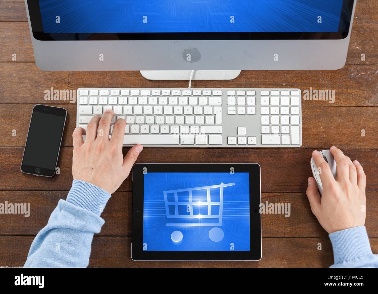 Digital composite of Person using Tablet and computer with Shopping ...