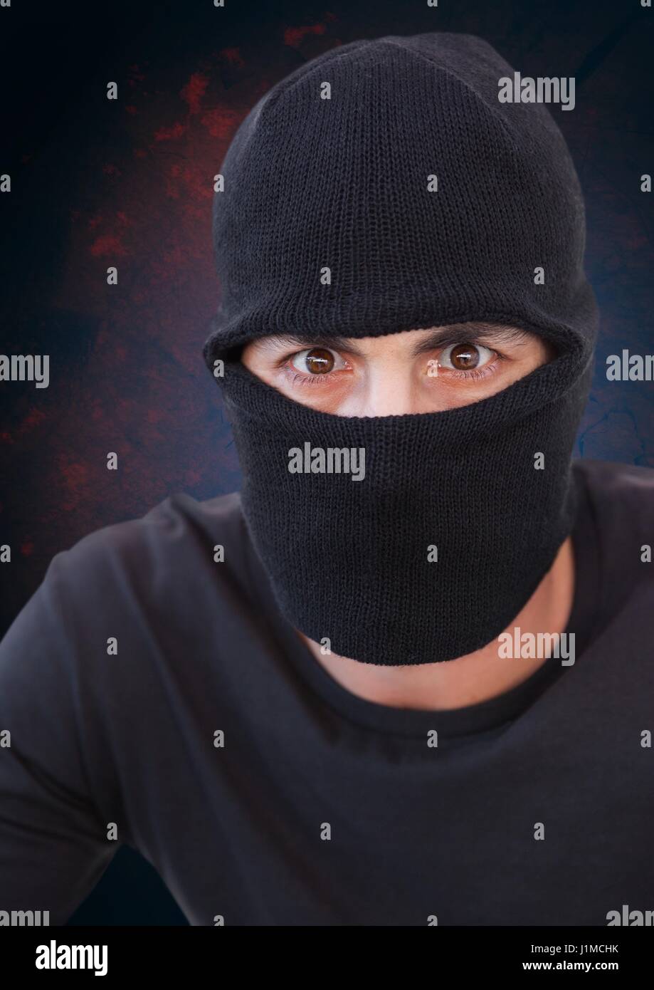 Digital composite of Criminal in balaclava with blue background Stock ...