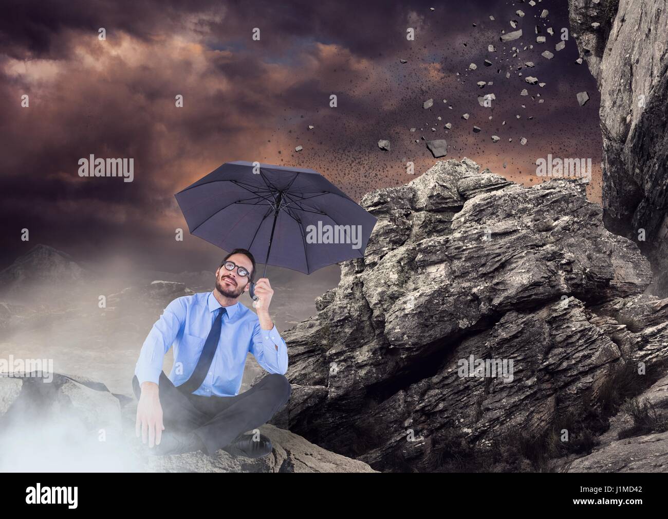 Digital composite of Business man legs crossed with umbrella and mist ...