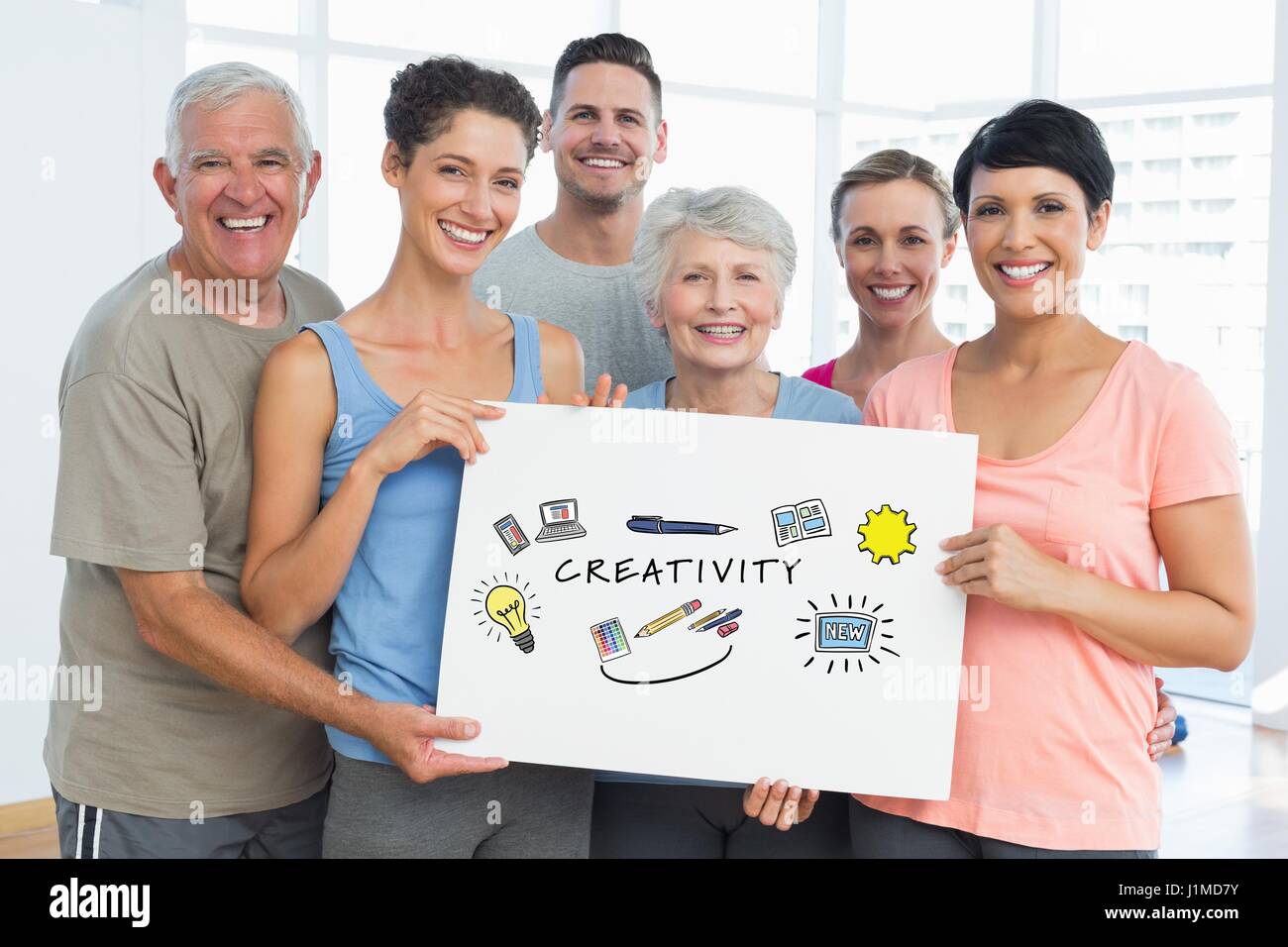 Digital composite of Portrait of family holding billboard with ...