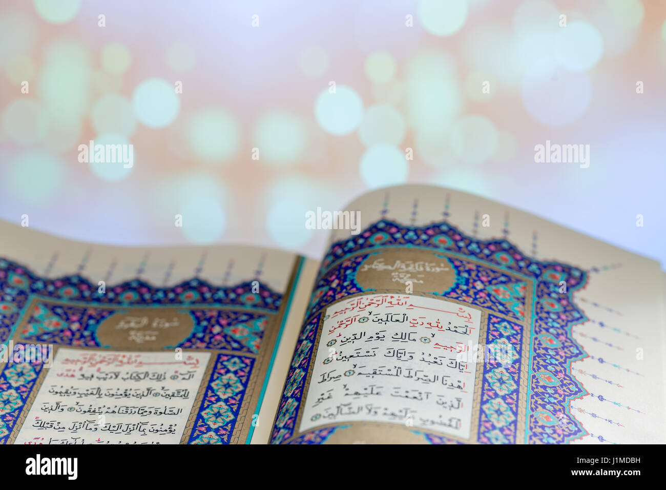 Opening pages of holy book Qur'an with lights background Stock Photo ...