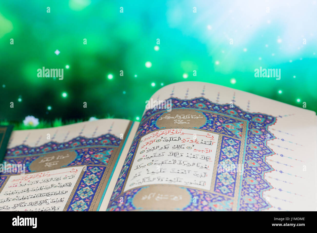 Opening pages of holy book Qur'an with green lights background Stock ...