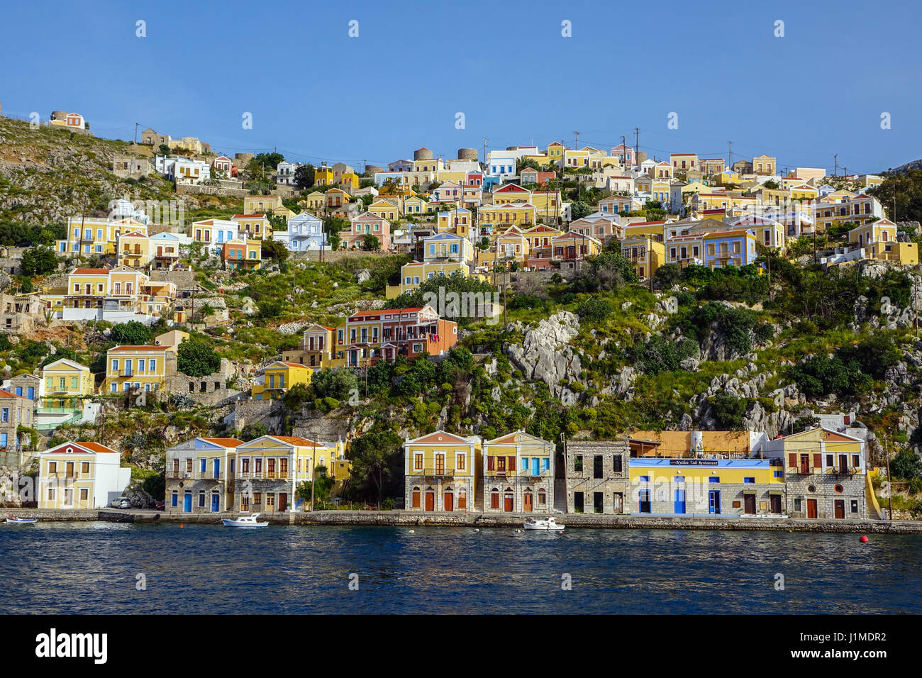 Colourful waterfront houses on Symi Simi, Greece Stock Photo - Alamy