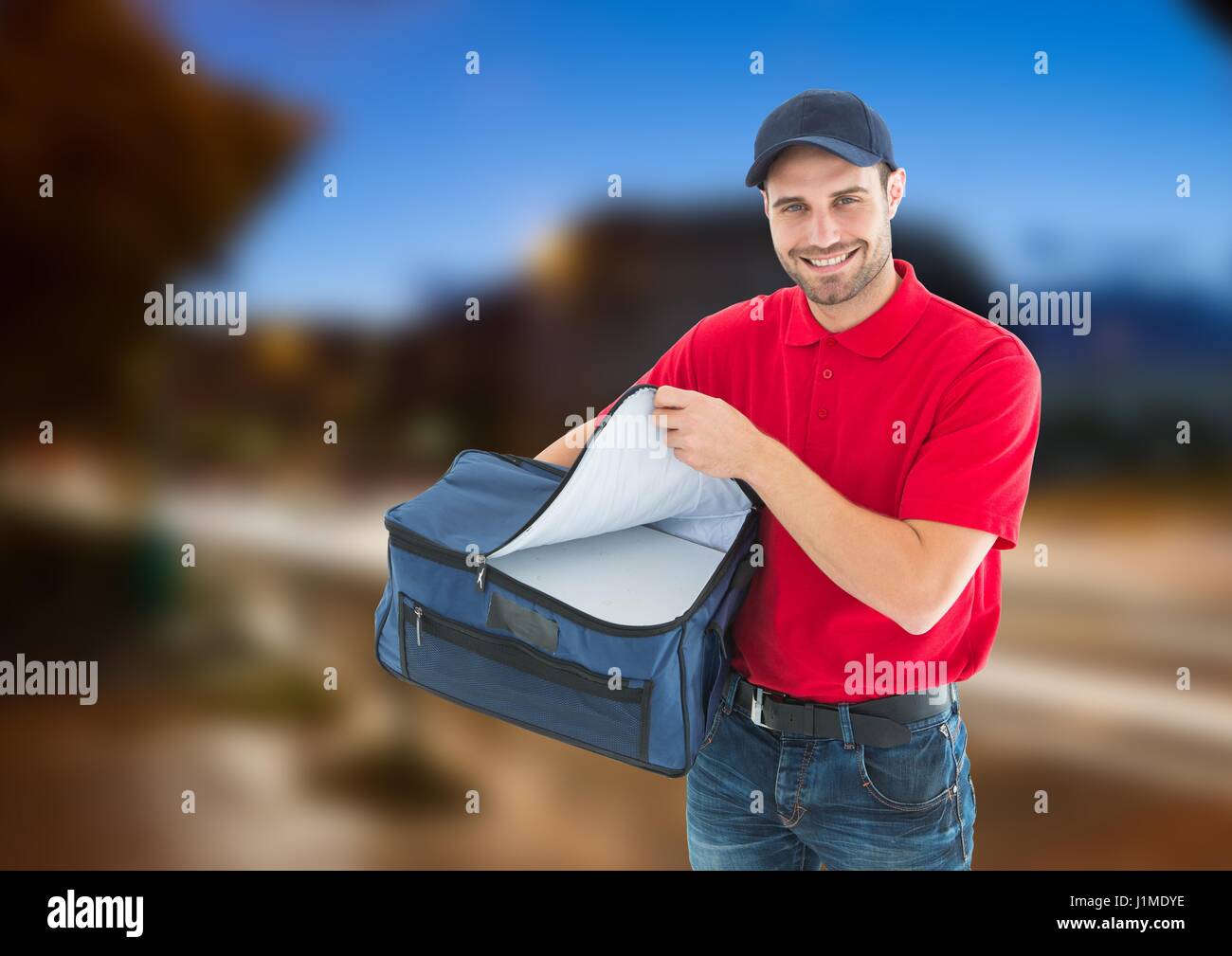 Digital composite of Happy pizza deliveryman with delivery bag in the ...