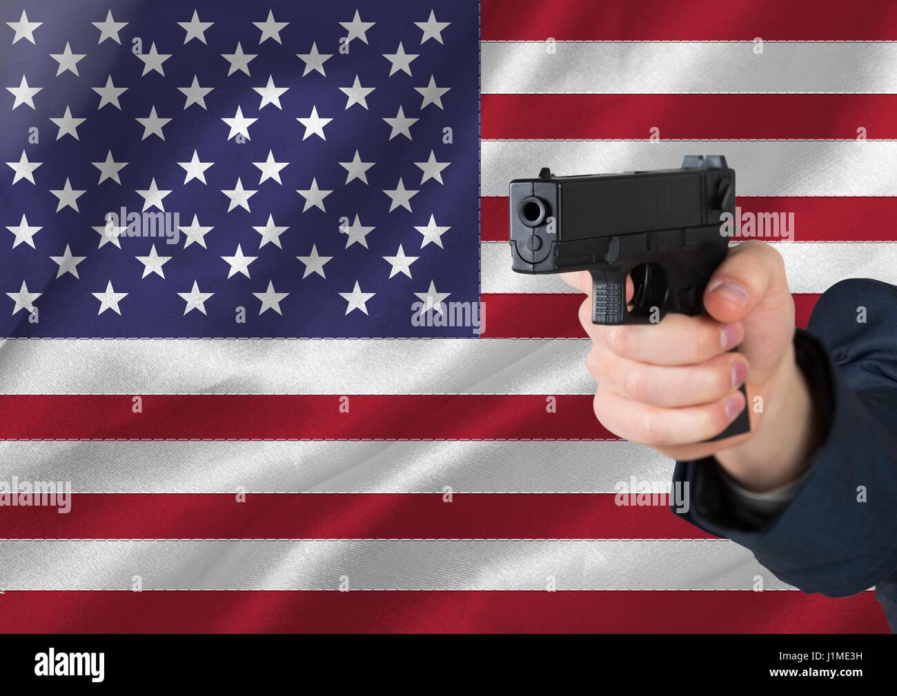 Digital composite of Hand holding gun with American flag Stock Photo ...