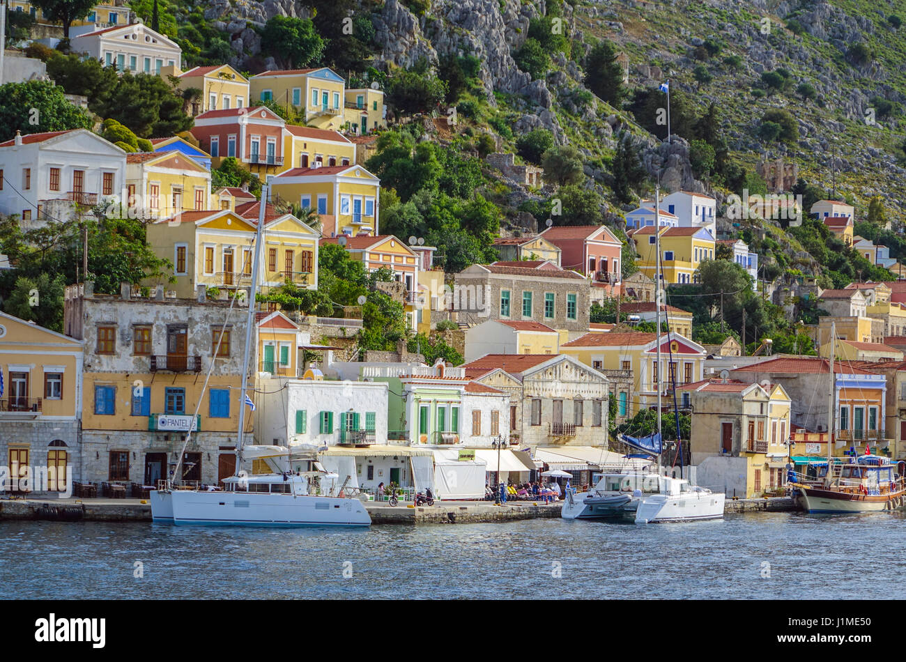 Colourful waterfront houses on Symi Simi, Greece Stock Photo - Alamy