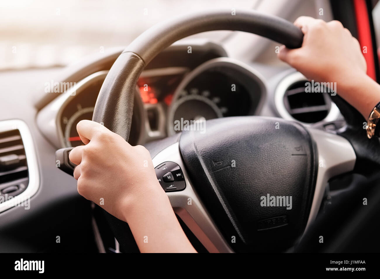 Female driving car Stock Photo - Alamy