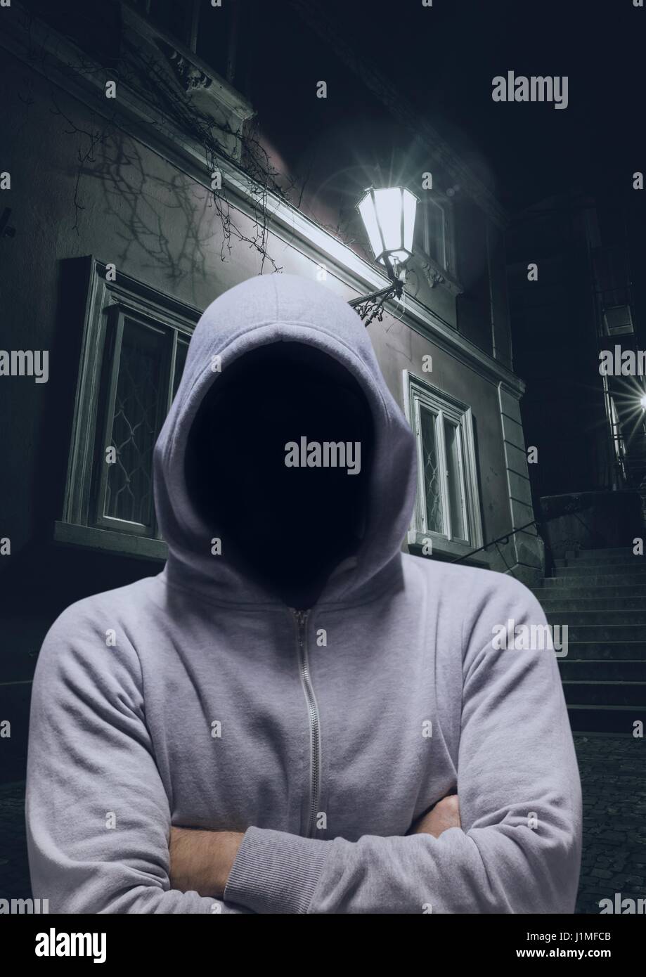 Digital composite of Anonymous Criminal in hood on dark street Stock ...