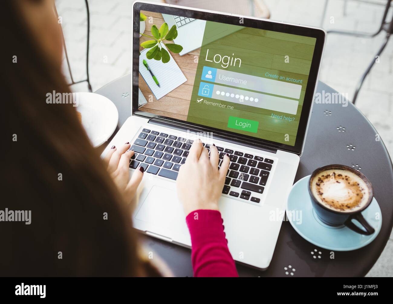 Digital composite of Woman in a cafeteria with laptop with login screen ...