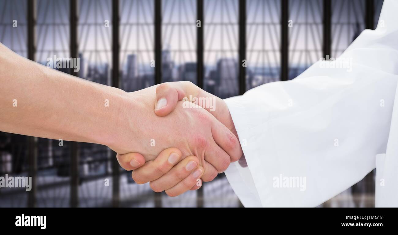 Doctor and patient shaking hands in modern hi-res stock photography and ...