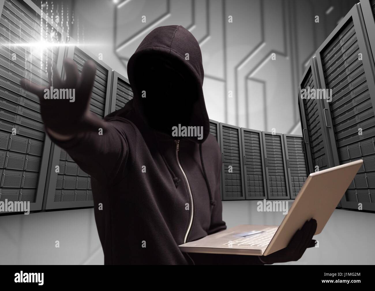 Digital composite of Anonymous Criminal in hood with laptop in front of ...