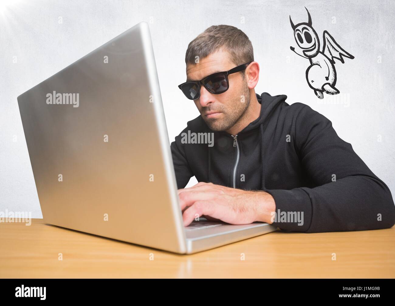 Digital composite of Criminal on laptop with devil icon floating ...