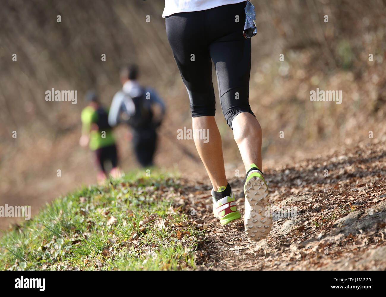 Athletes running around track hi-res stock photography and images - Alamy
