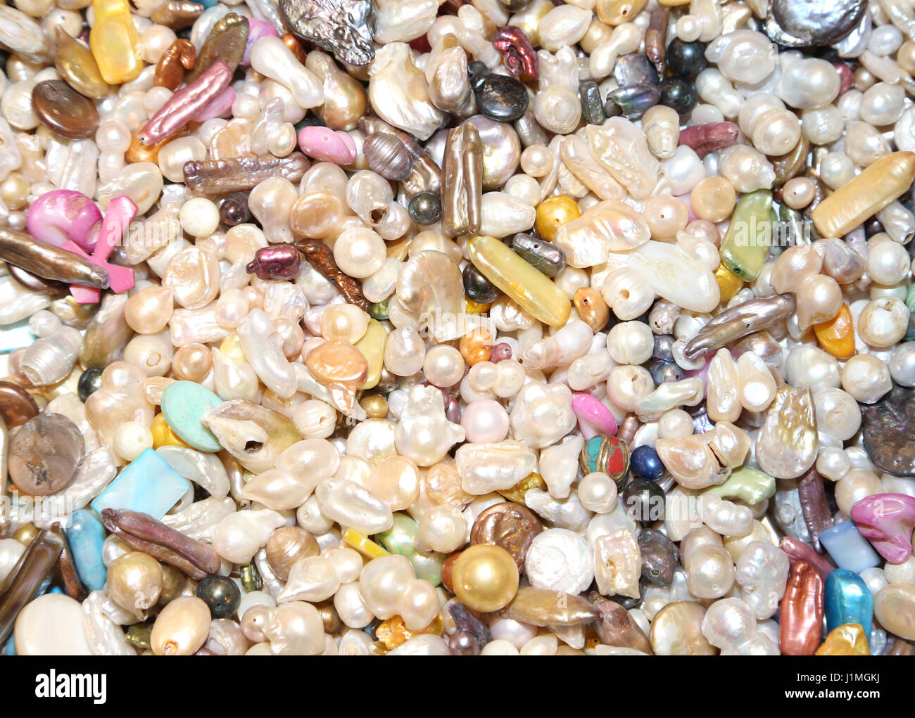 thousands of shimmering pearls to create many necklaces Stock Photo - Alamy