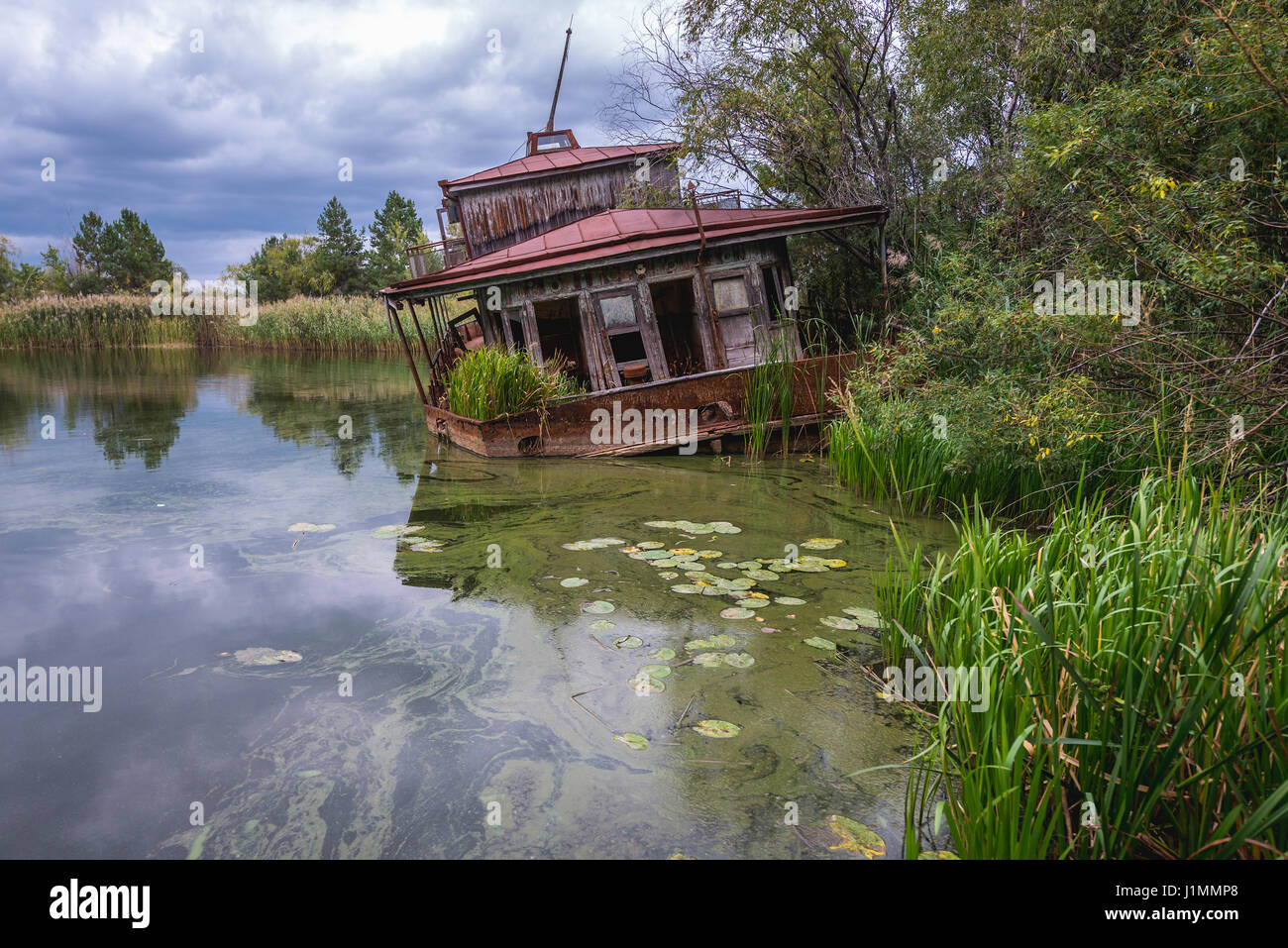 Sinking boat on a Yanov backwater in Pripyat ghost city of Chernobyl ...
