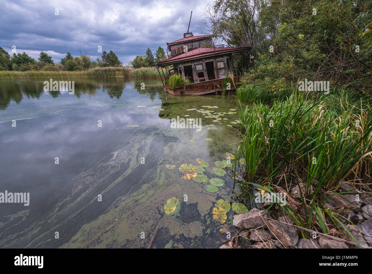 Sinking boat on a Yanov backwater in Pripyat ghost city of Chernobyl ...