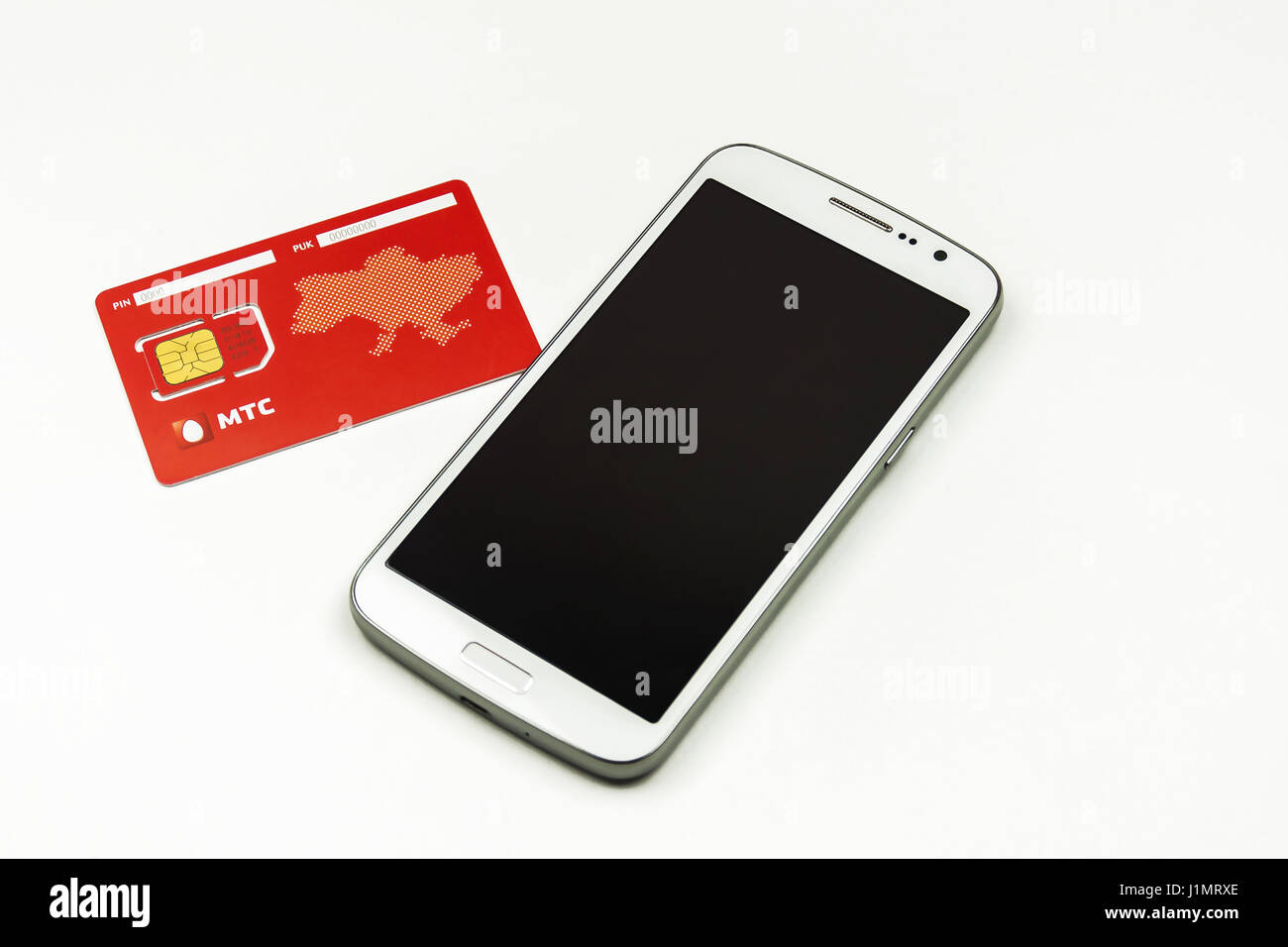 Smartphone and SIM card of mobile operator MTS Stock Photo - Alamy