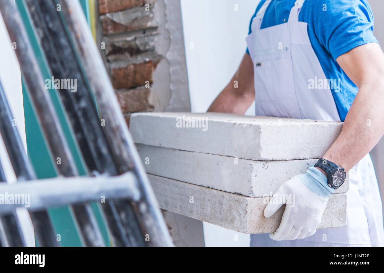 Construction Worker Moving Concrete Materials For House Interior ...