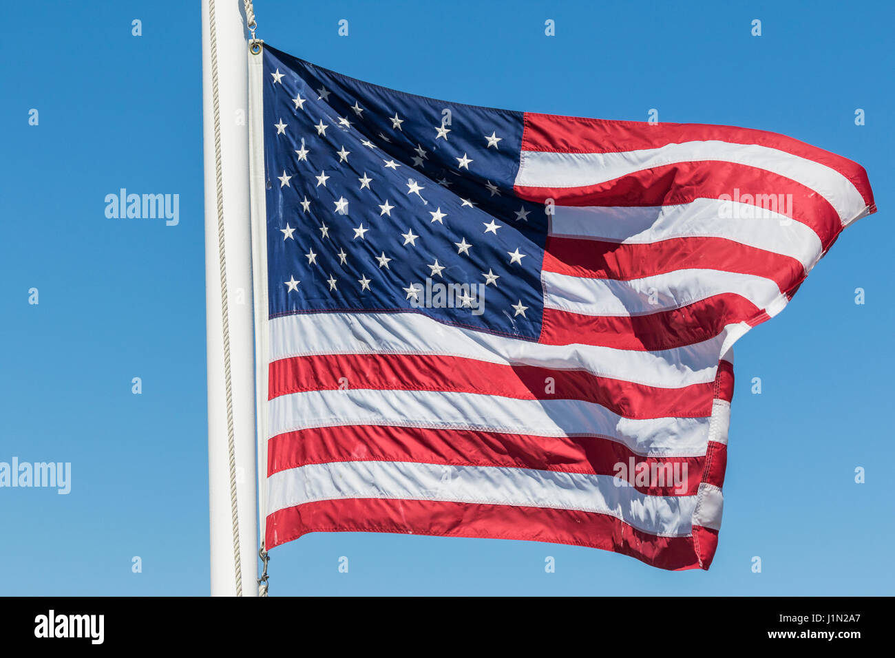 United States Flag blowing in the wind on the Galveston-Bolivar Ferry ...