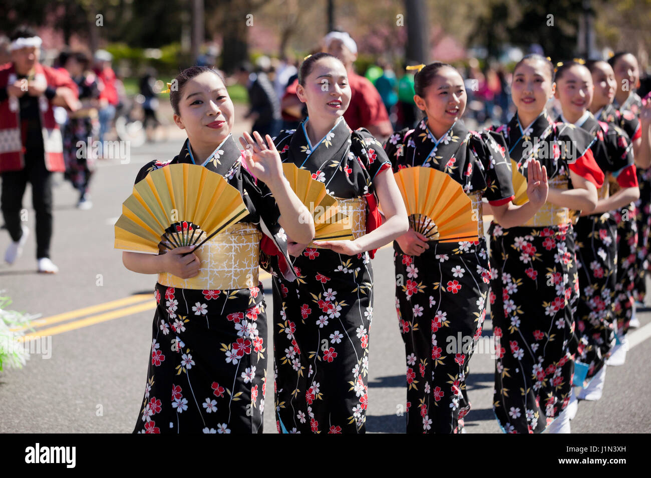 Young Japanese girls marching in the National Cherry Blossom Festival ...