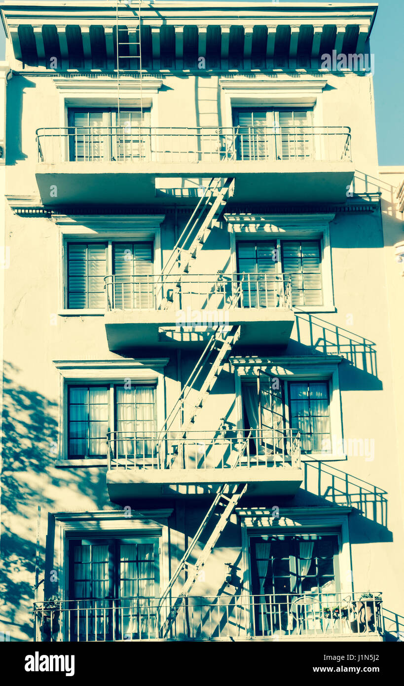 Retro styled image four storey building with characteristic old city ...