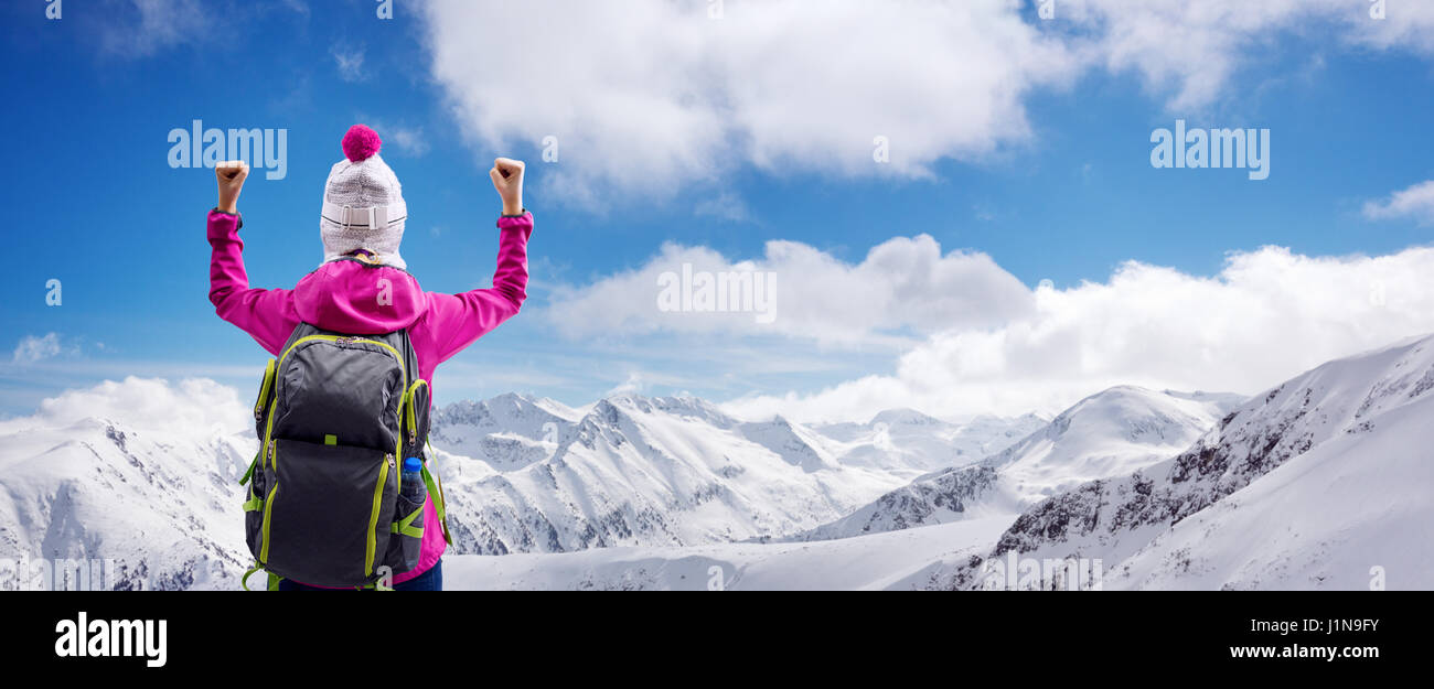 Happy winner on top of mountain, back view Stock Photo - Alamy