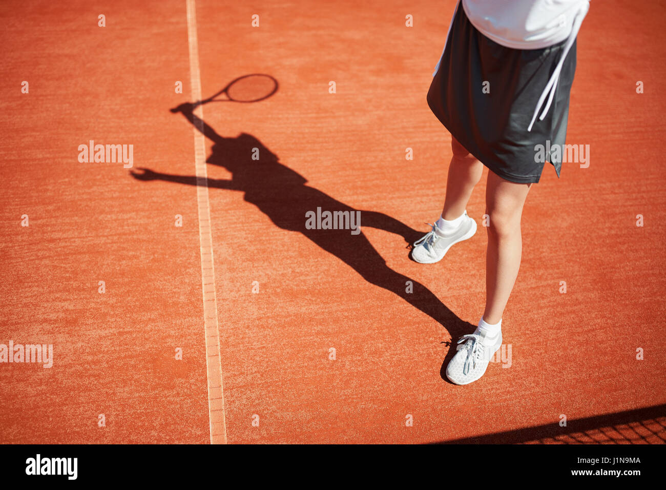 Tennis player shadow on court hi-res stock photography and images - Alamy