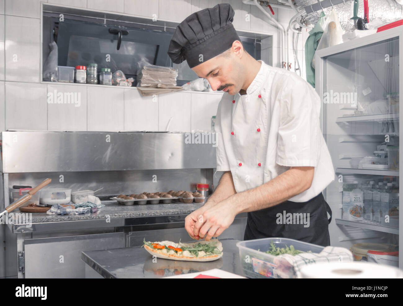 professional one young adult man chef making sandwich, commercial ...