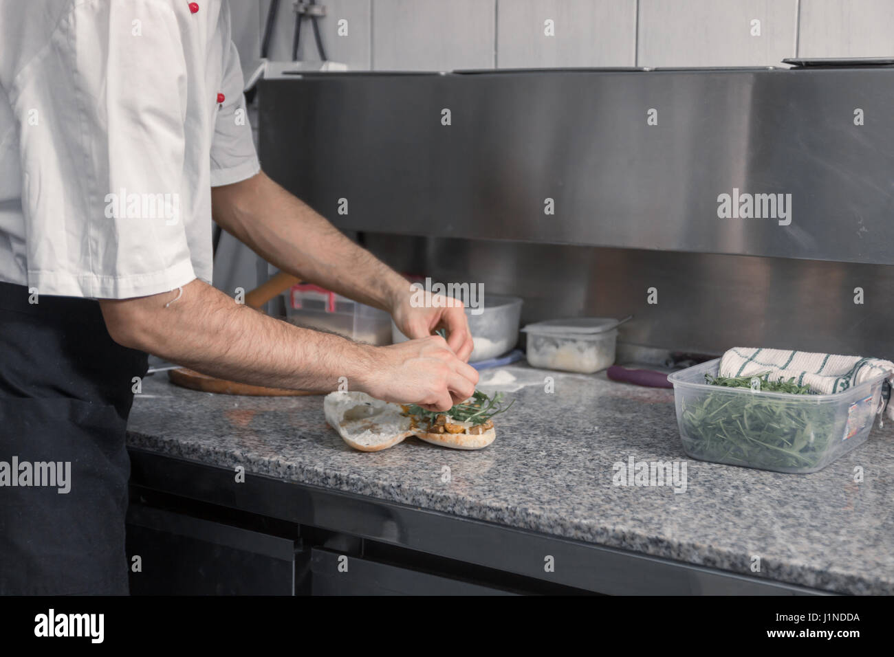 closeup hands chef preparing sandwich, kitchen Stock Photo - Alamy